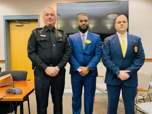 Two police department detectives-corporals take oaths of office ...